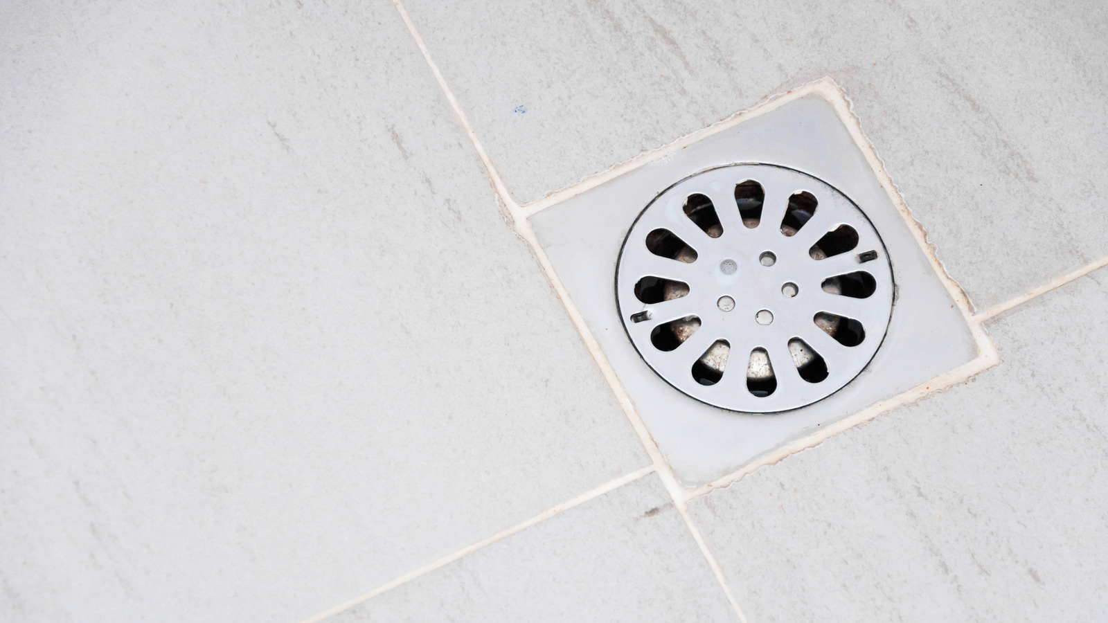 9 Common Reasons Your Shower Drain Is Clogged (& The Best Ways To Fix It)