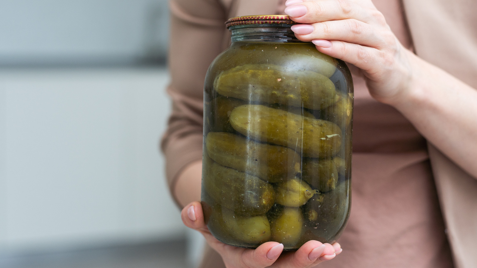 Combat Kitchen Counter Clutter With The Help Of A Pickle Jar. Here's How