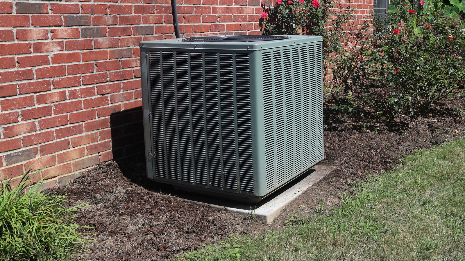 Cover An Unsightly AC Unit With A DIY Wooden Pallet Project