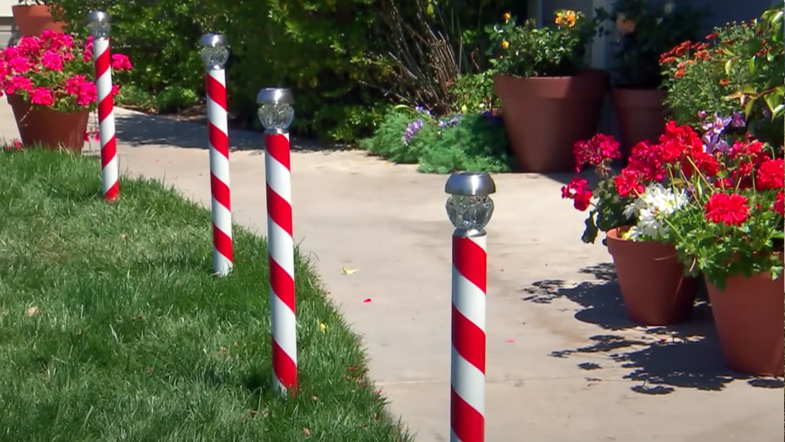 DIY A Cute Candy Cane Walkway For The Holidays With This Dollar Tree Hack