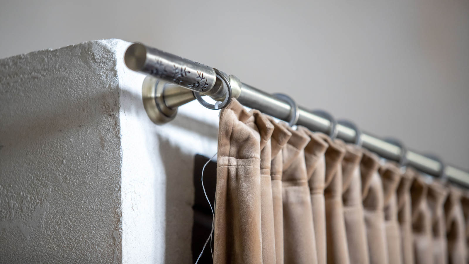 Here's How To Secure Curtain Rods On Block Walls For A Brand-New Look