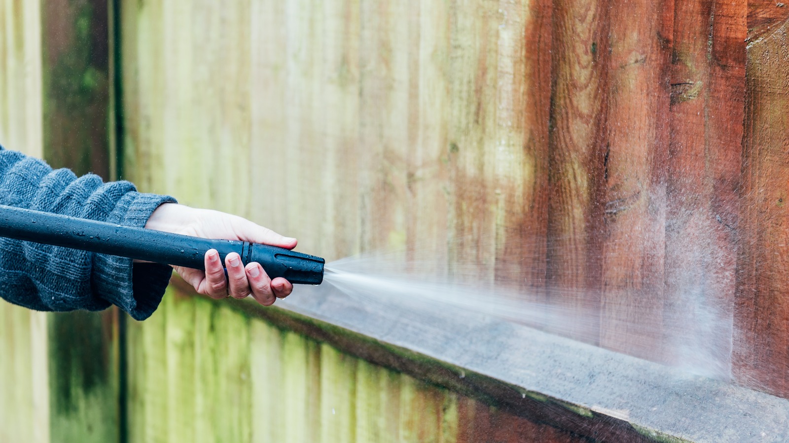 Here's Why Pressure Washing Isn't Always The Best Way To Clean A Shed