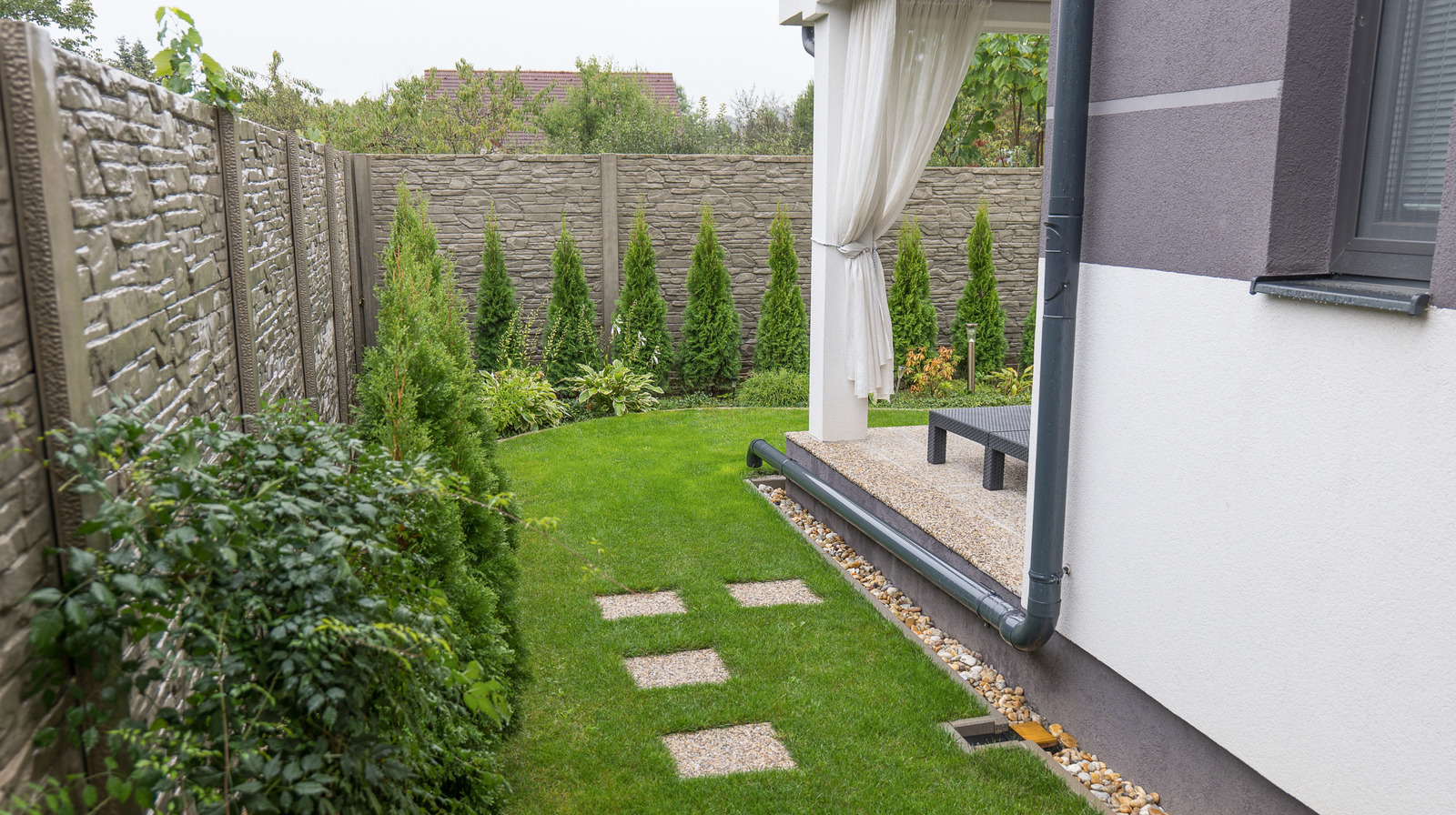 How To Turn The Unsightly Downspout In Your Yard Into A Stunning Display