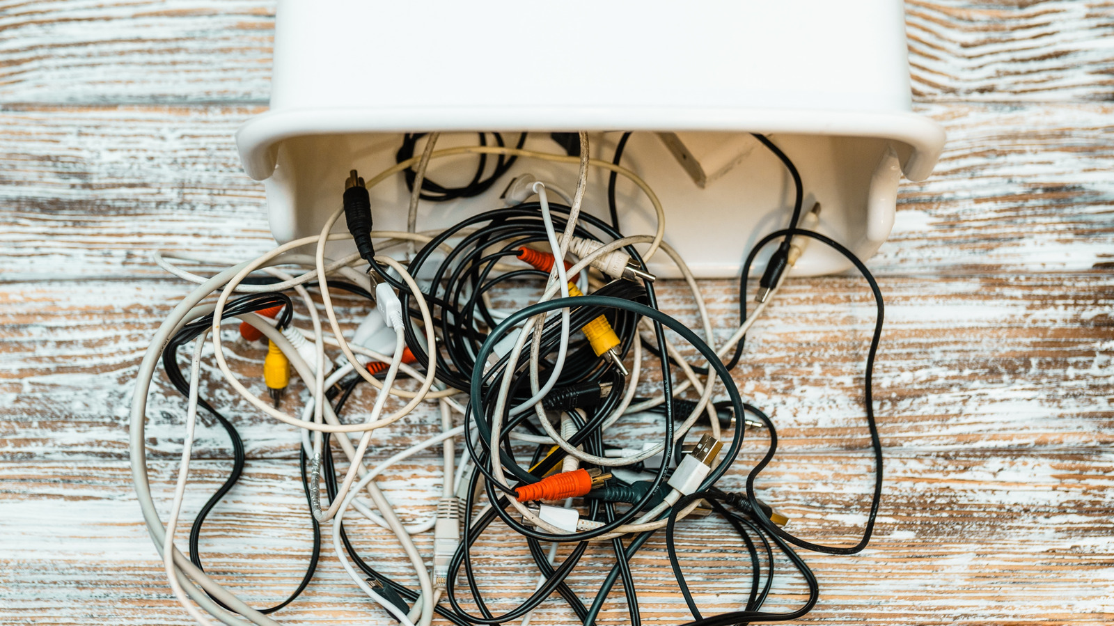 Keep Cords Organized And Clutter-Free By Using An Old Shoe Box
