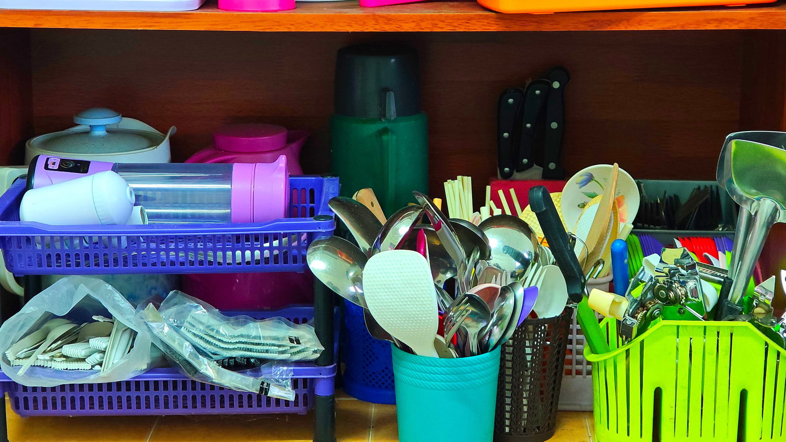 Easily Organize Cluttered Kitchen Cabinets With One Affordable Hack