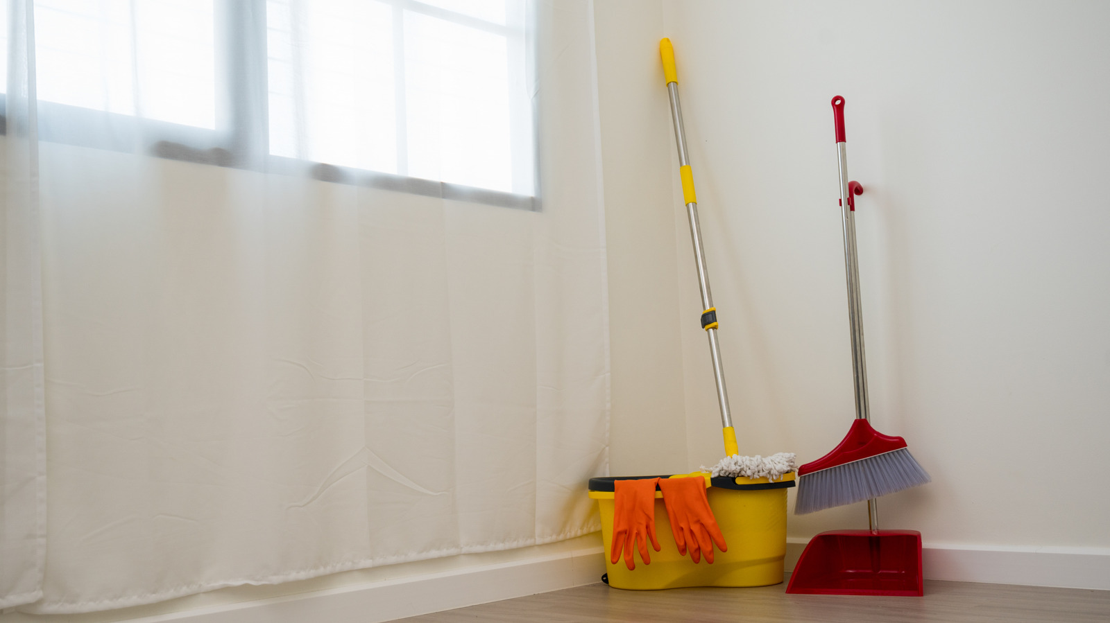 Keep Your Brooms, Mops, And More Organized With One Space-Saving Solution