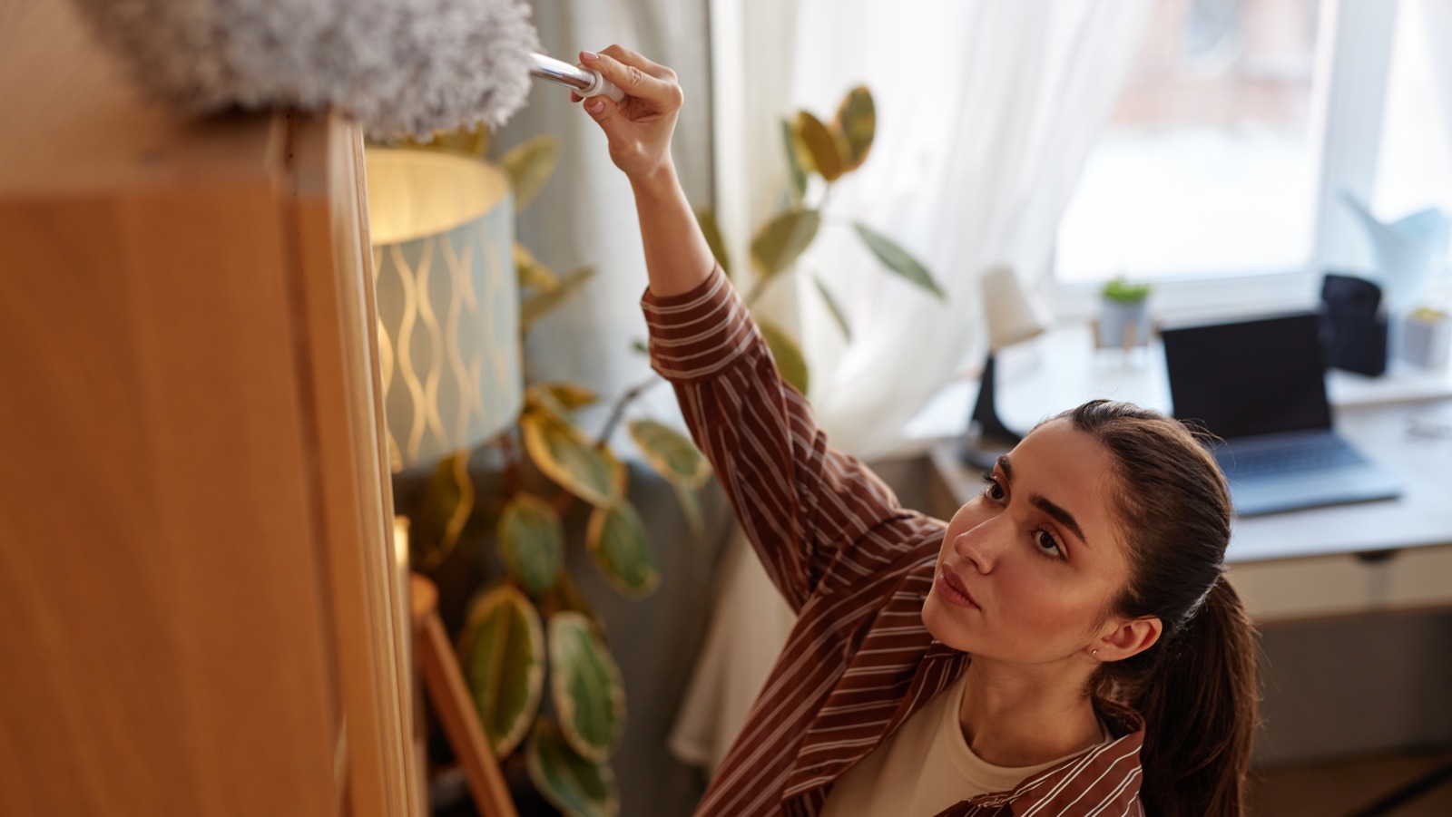 Never Worry About Dusting Tall Shelves Again By Reusing Old Newspaper
