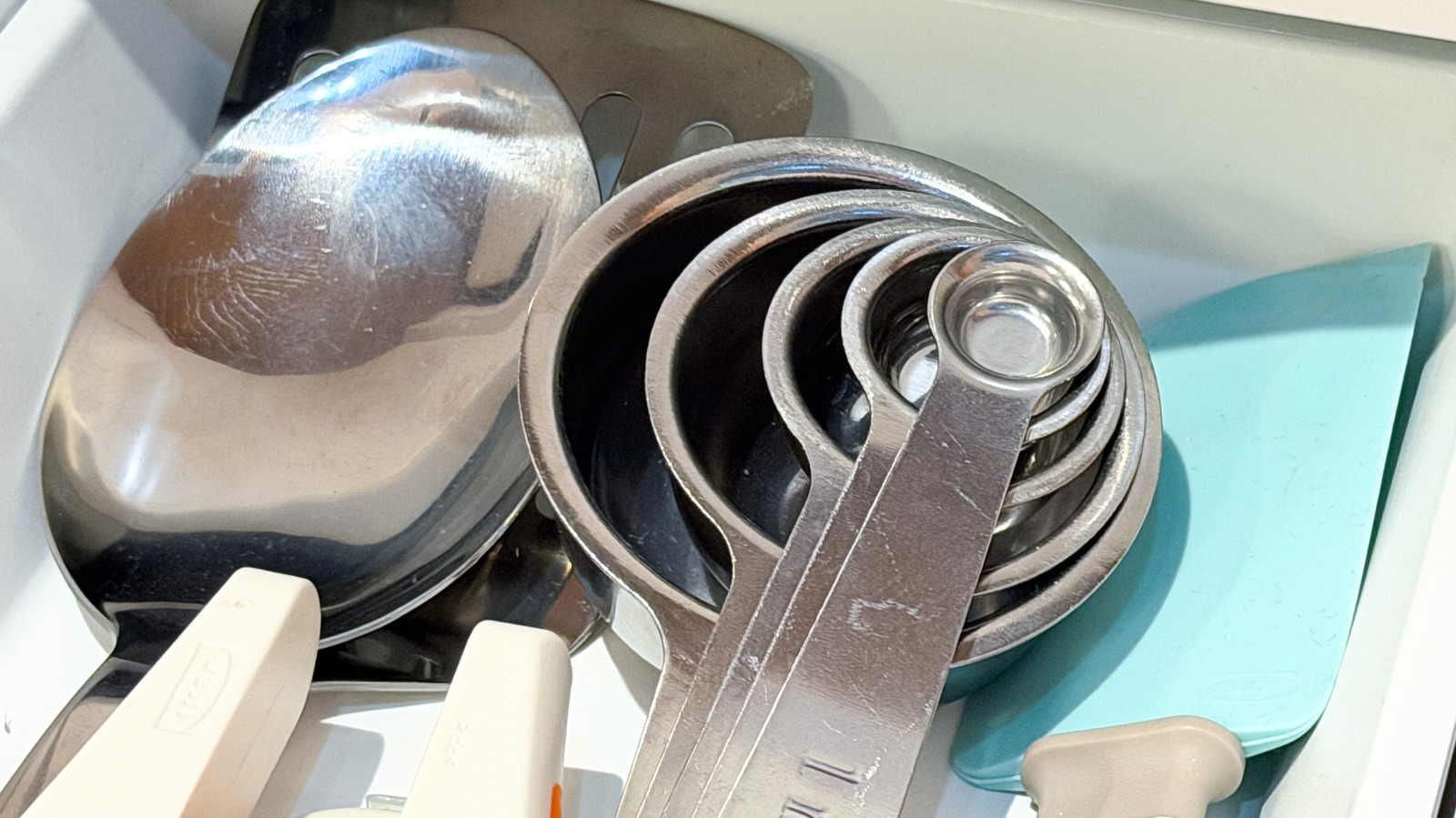 Dollar Tree Hack: Store And Organize Measuring Cups With A Towel Bar