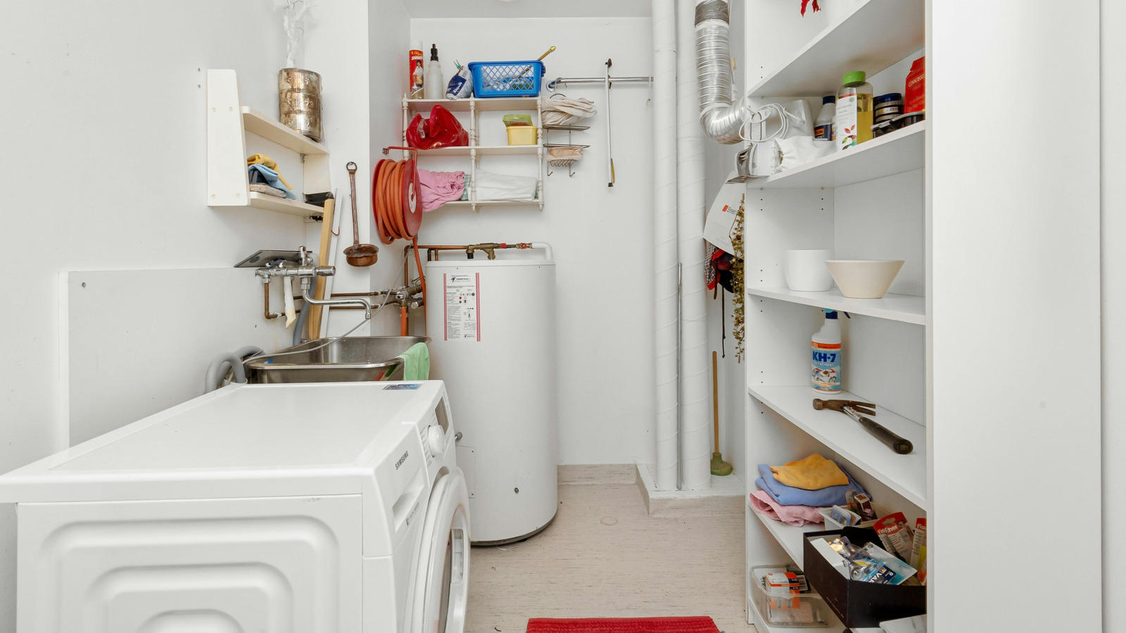 Hide Water Heater Eyesores With This Sleek DIY Solution That Adds Storage