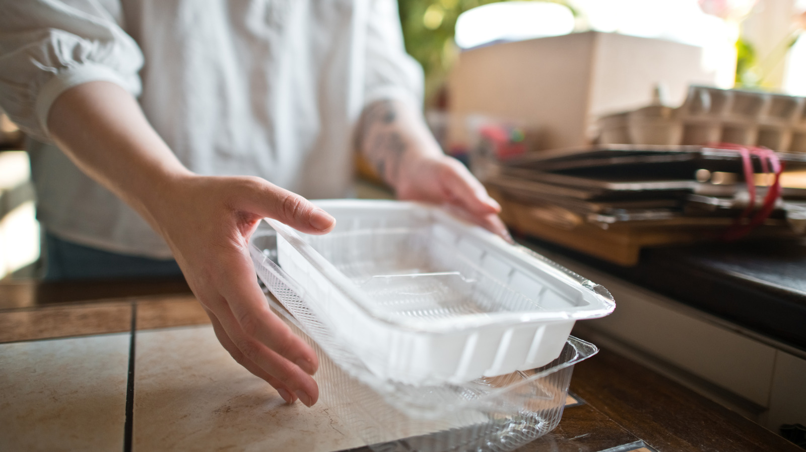 Skip The Bins: Turn Takeout Lids Into Clever Drawer Organizers