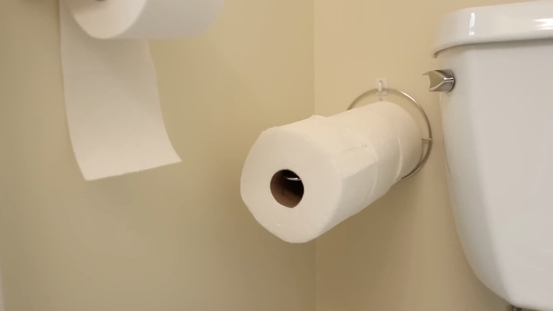 Store Extra Toilet Paper Rolls With A Simple Paper Towel Holder Solution