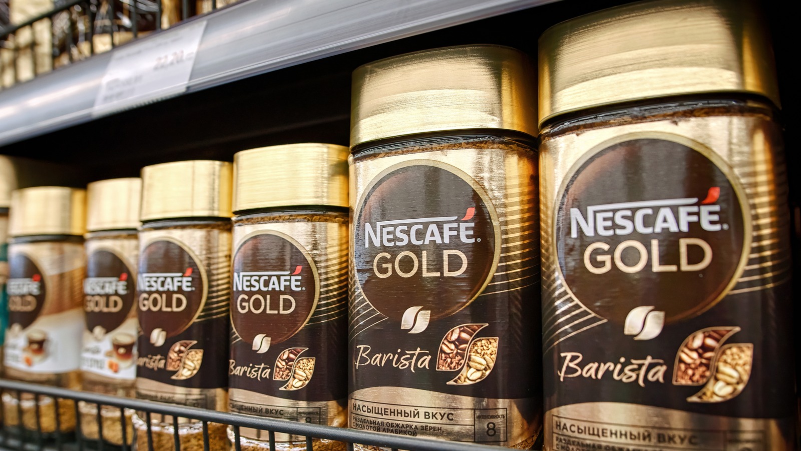 The Clever Way To Reuse Coffee Jars To Keep Your Spice Cabinet Organized