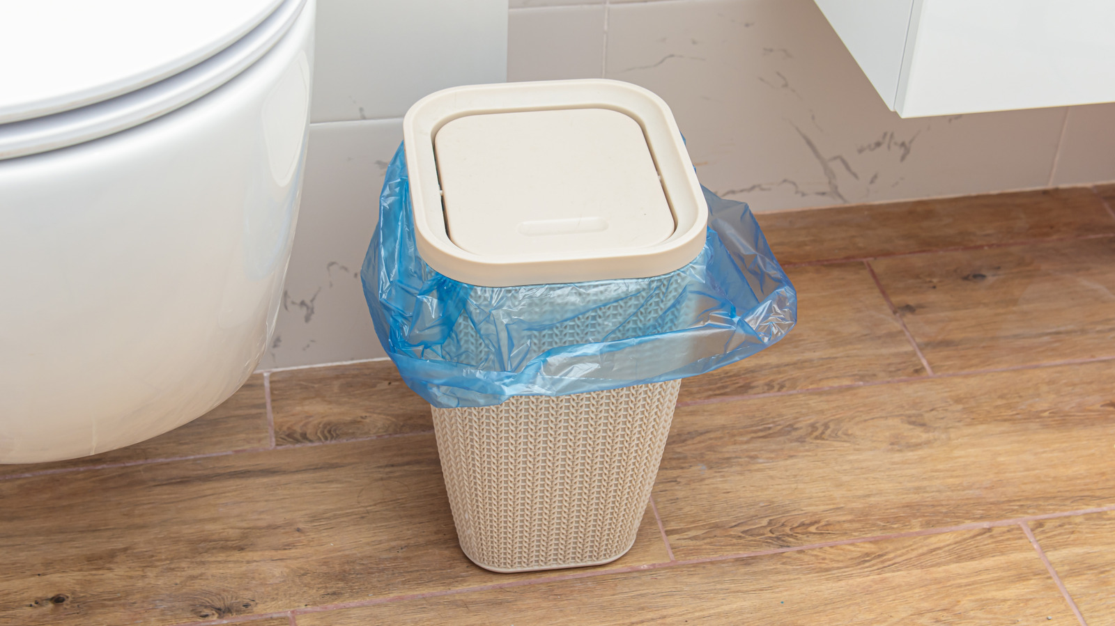 The Simple DIY That Hides Your Bathroom Trash Cans In A Snap