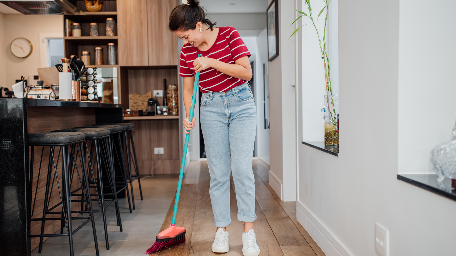 This Clever Broom Organization Trick Frees Up Space In Your Laundry Room