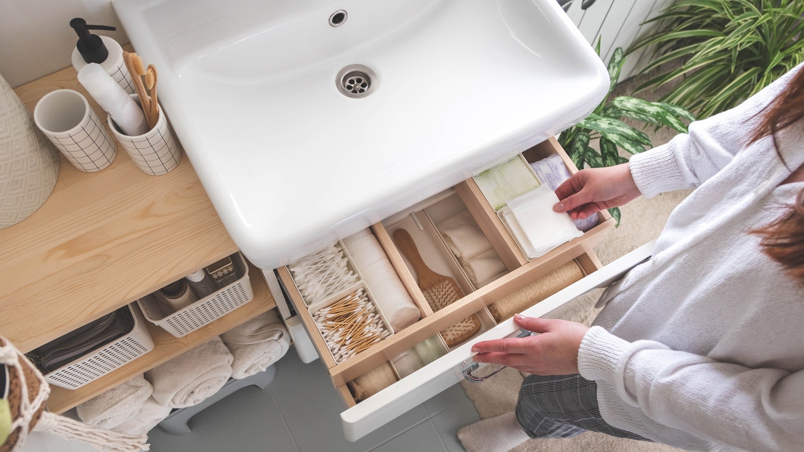 Turn Wasted Under-Cabinet Space Into A Hidden Bathroom Storage Solution