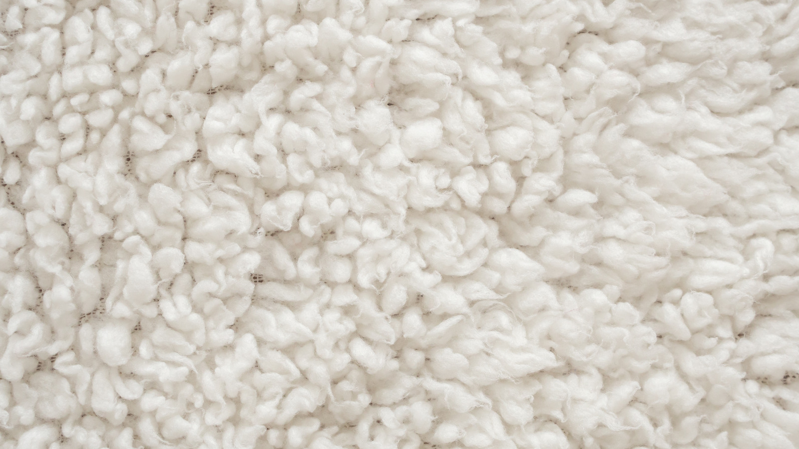 Turn Your Sofa Into A Stylish Cloud Couch With This Blanket Hack