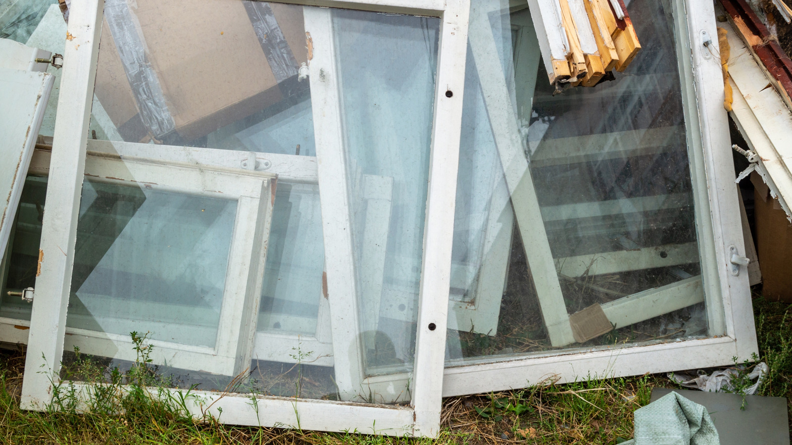 Upcycle Glass Windows For A Beautiful Rustic Greenhouse