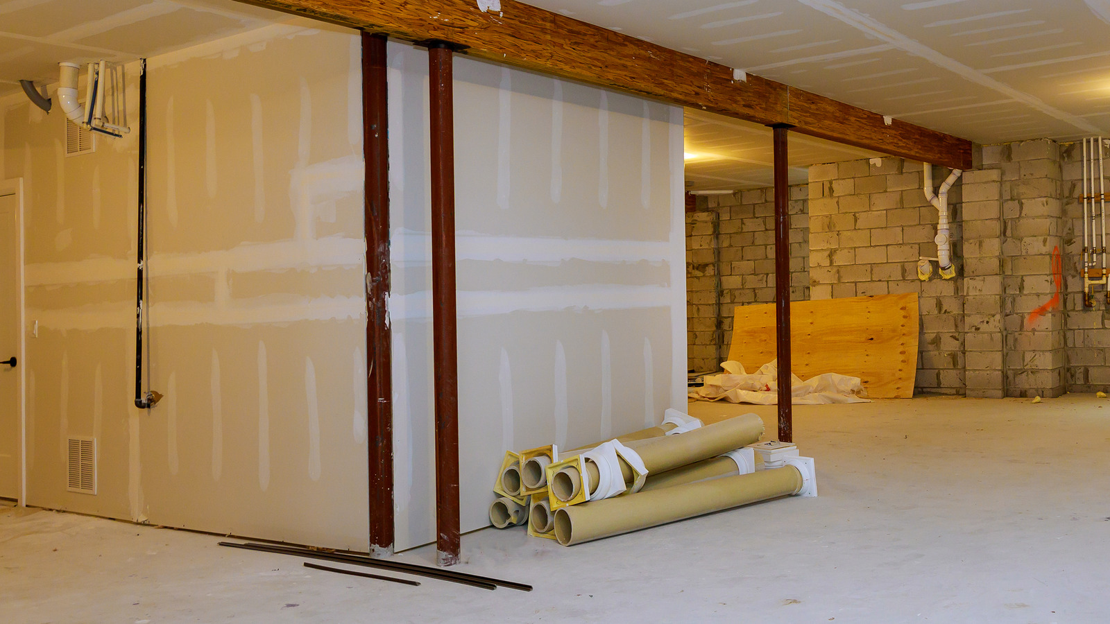 Use This Clever Pool Noodle Hack To Cover Unsightly Poles In Your Basement