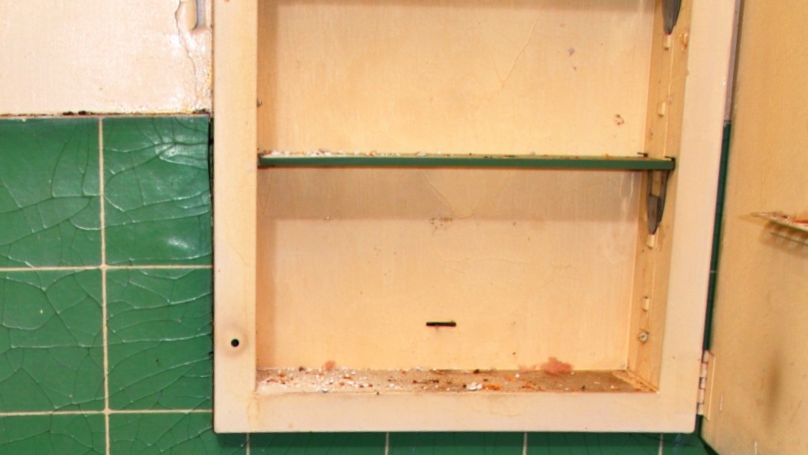 What The Slit In The Back Of Your Old Medicine Cabinet Is Actually For