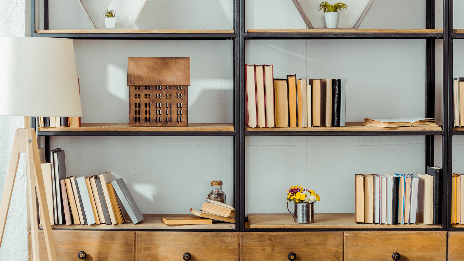 Why A Book Vase Is A Stunning Solution For That Boring Shelf In Your Home